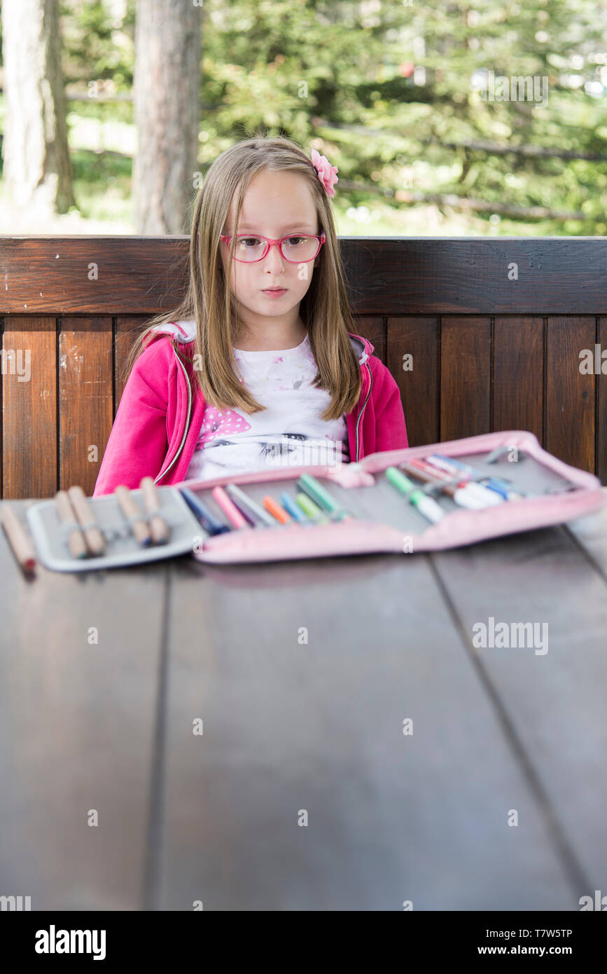 Beautiful girl doing homework in the nature Stock Photo - Alamy