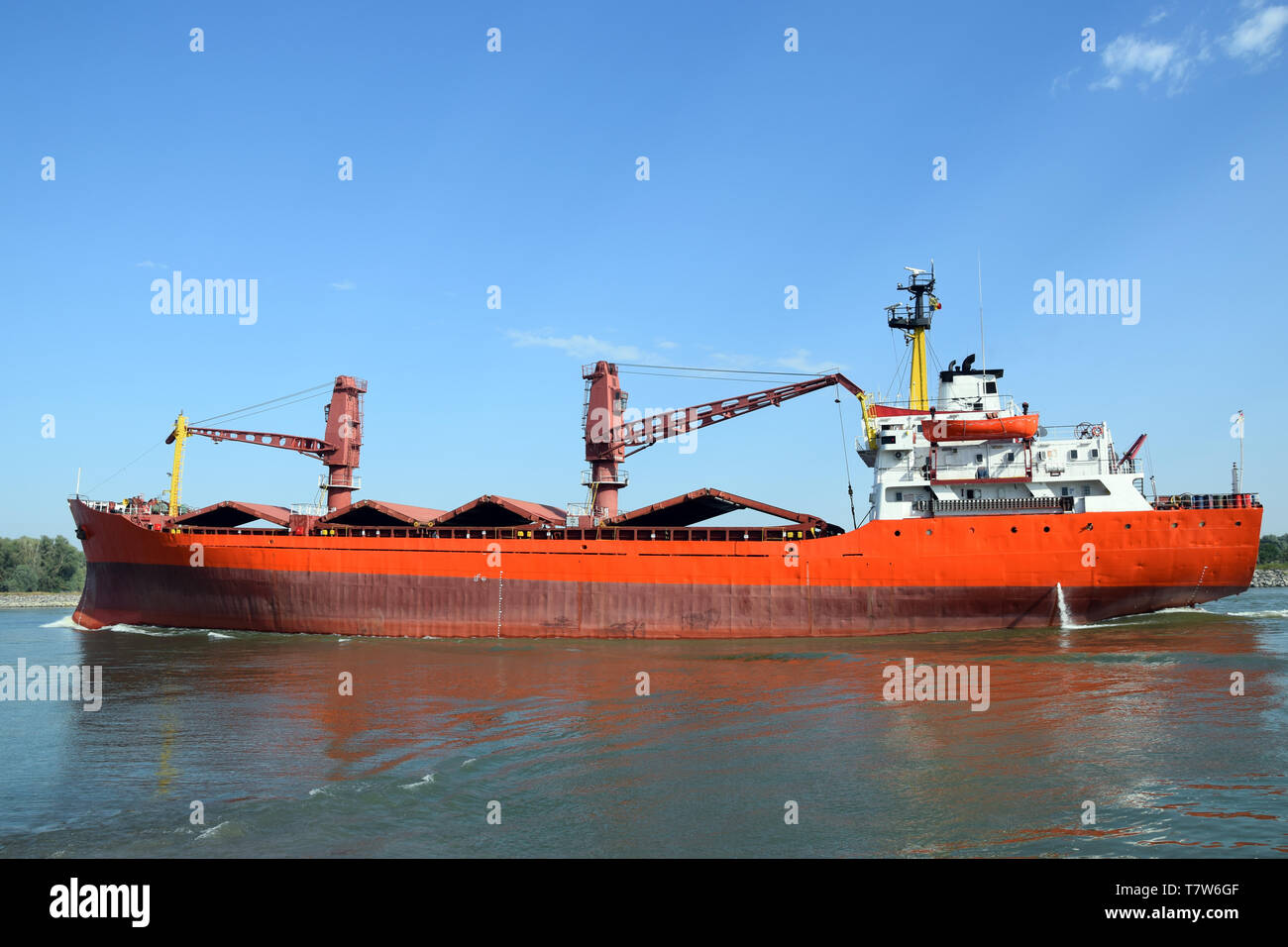 Cargo ship (bulk carrier) floats on the Danube river. Sulina, Danube ...
