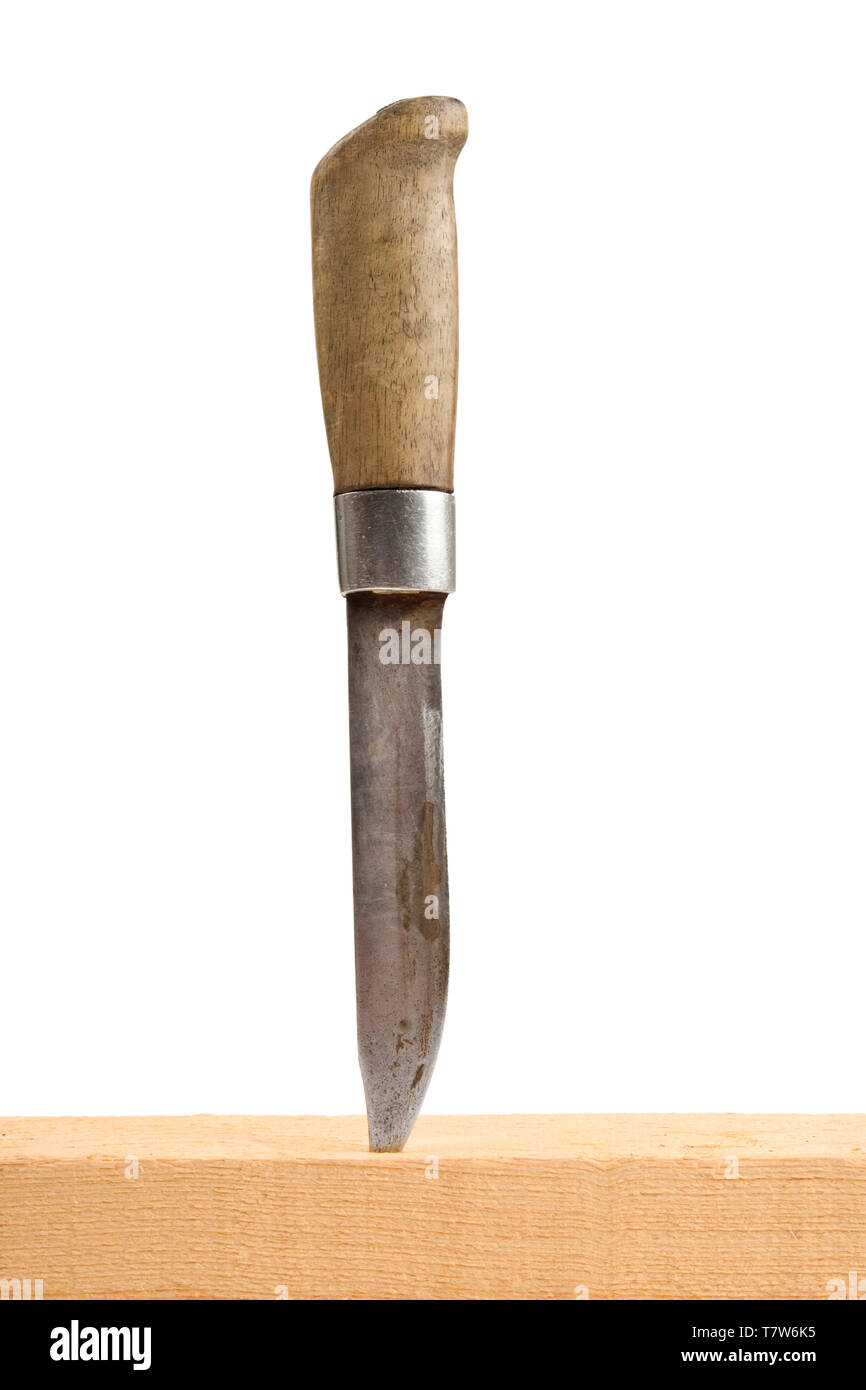 Old hunting knife stuck in a plank. Isolated on white background Stock ...