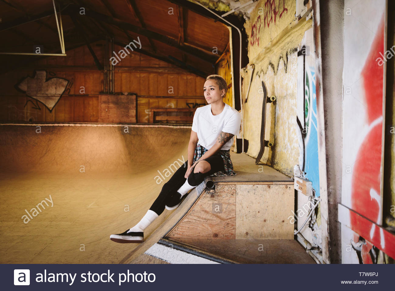 Skateboarder sitting on ramp hi-res stock photography and images - Alamy