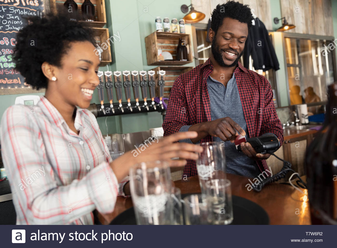 Bartender behind bar hi-res stock photography and images - Alamy