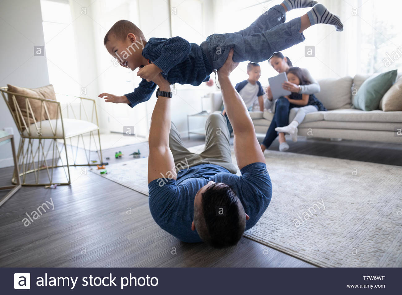 Lifting children hi-res stock photography and images - Alamy
