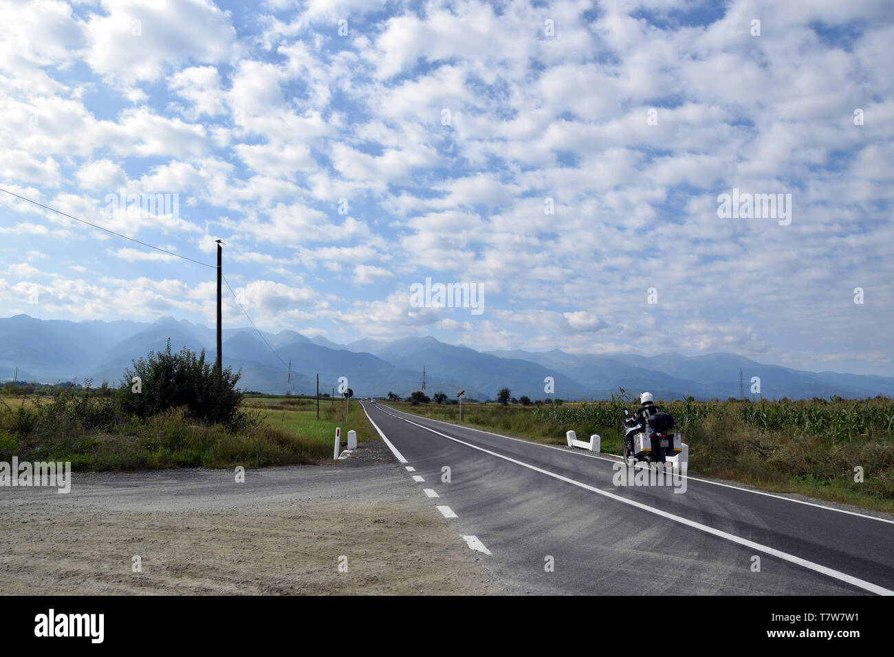 Touristic enduro motorbike in mountain travel. Landscape of Fagaras ...