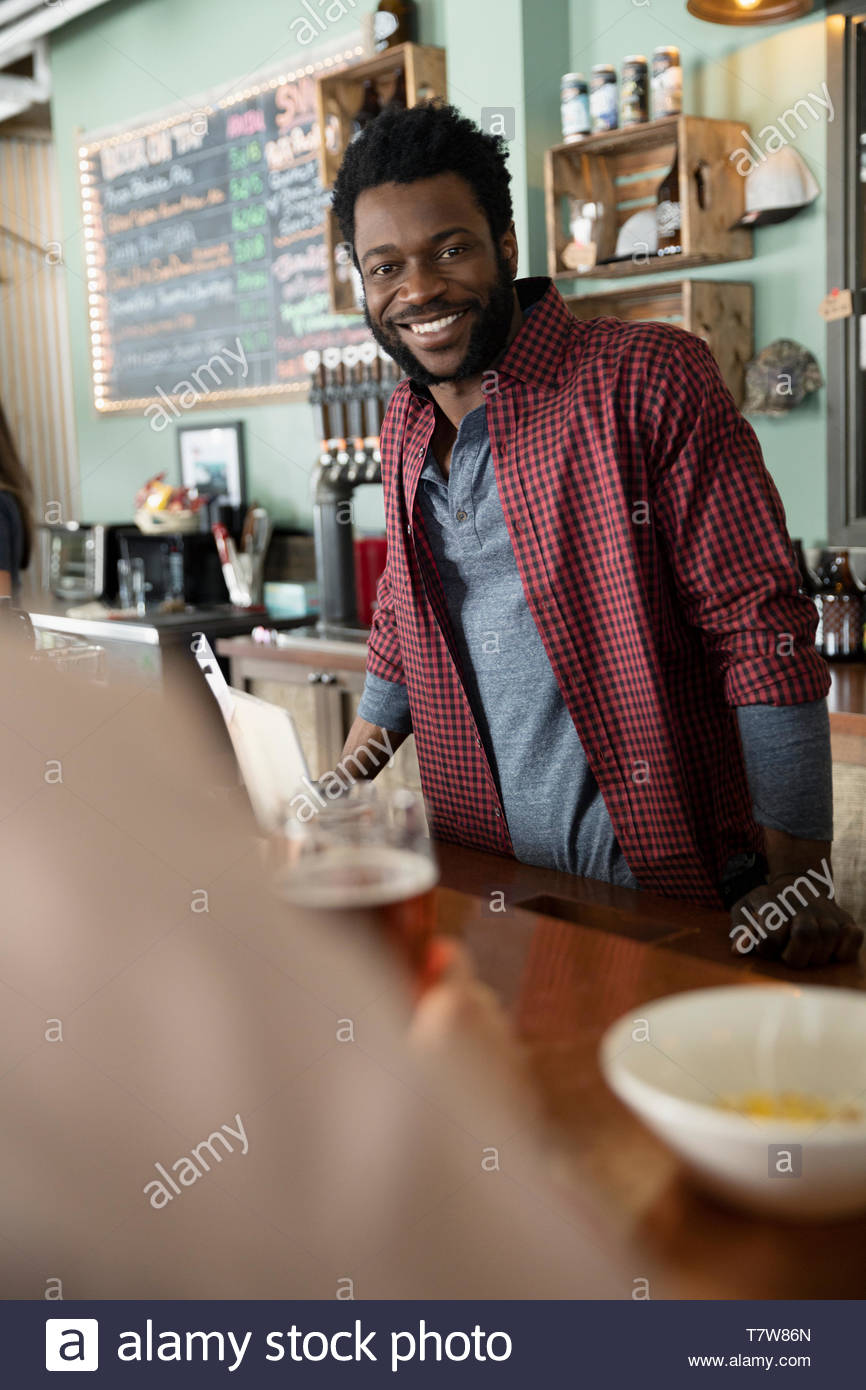 Bartender behind bar hi-res stock photography and images - Alamy