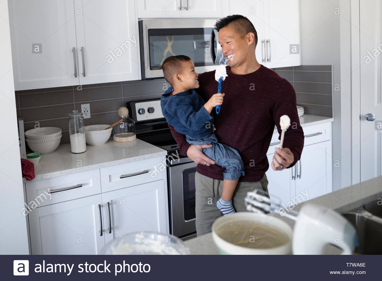 Parent Child Messy Kitchen Stock Photos & Parent Child Messy Kitchen ...