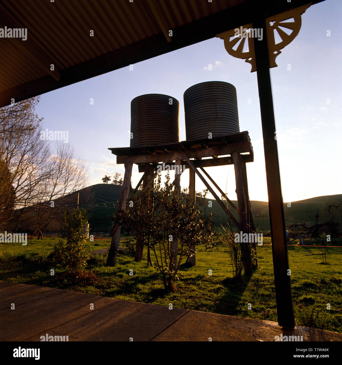 Galvanized iron water tanks on platforms in grounds of an Australian ...