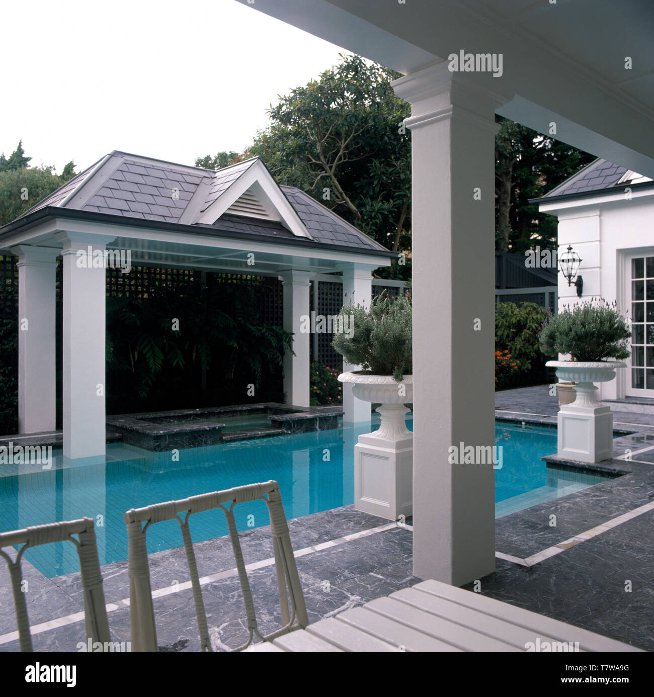 View from veranda of a turquoise swimming pool Stock Photo - Alamy