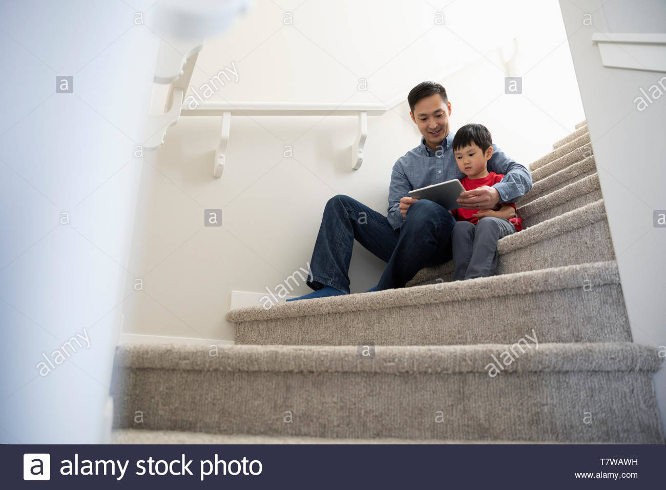 Father using computer son hi-res stock photography and images - Alamy