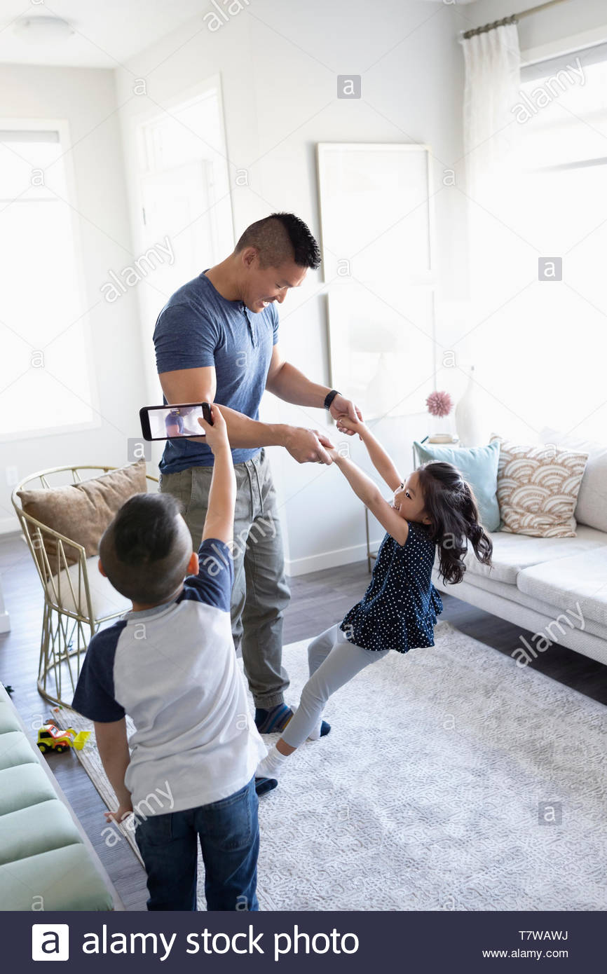 Father and children playing indoors hi-res stock photography and images ...