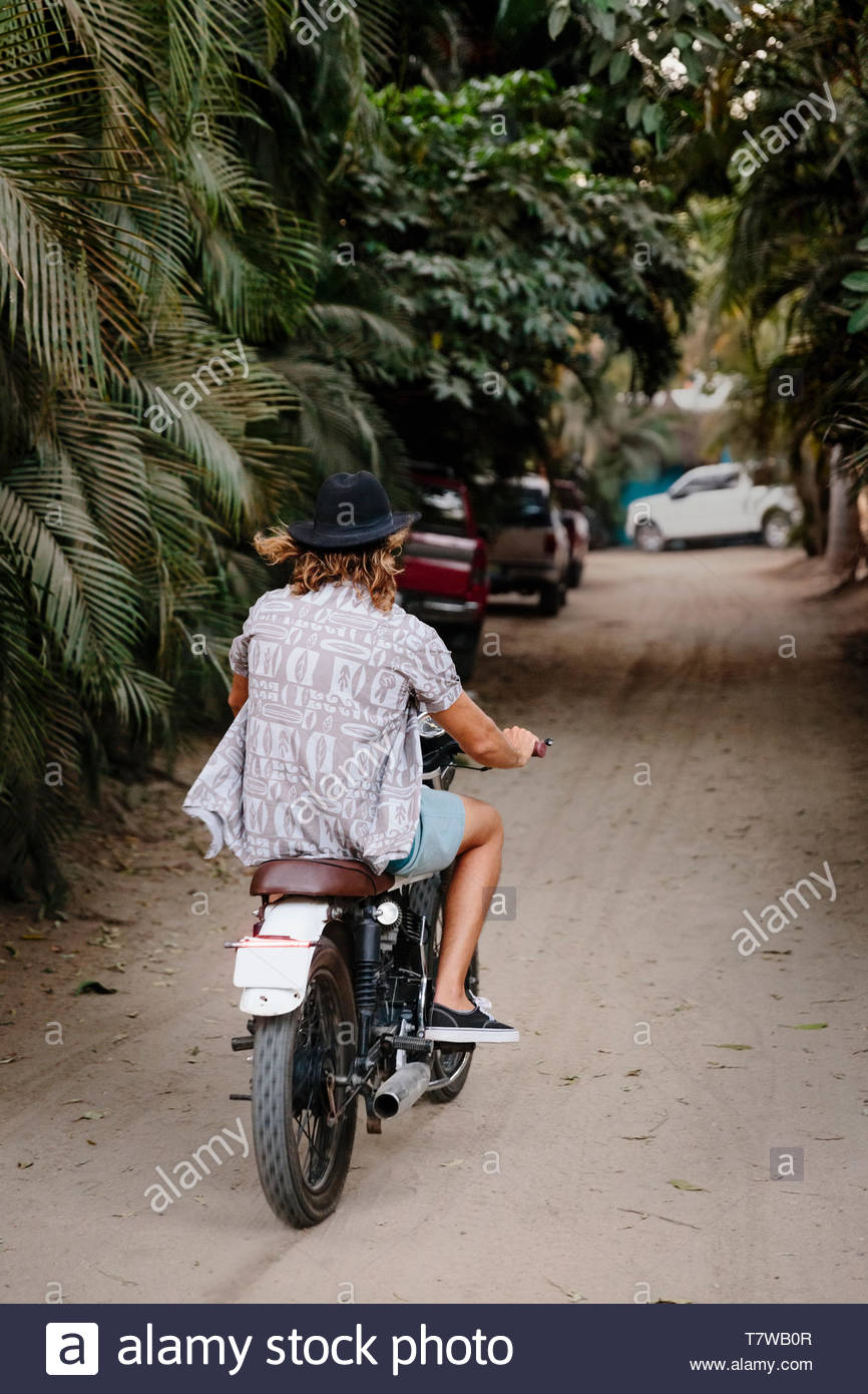 Rear view riding motorcycle hi-res stock photography and images - Alamy