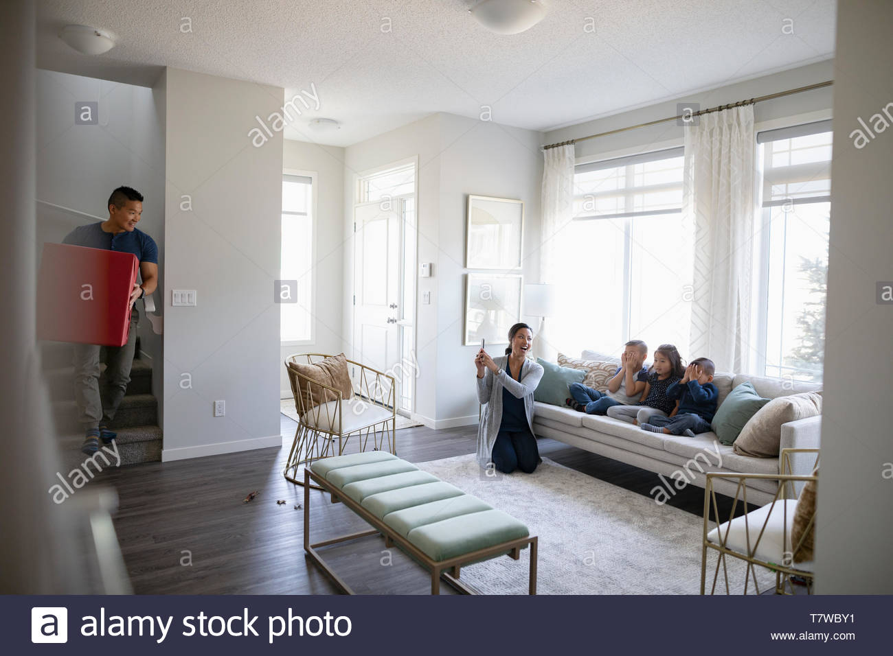 Children covering parents eyes hi-res stock photography and images - Alamy