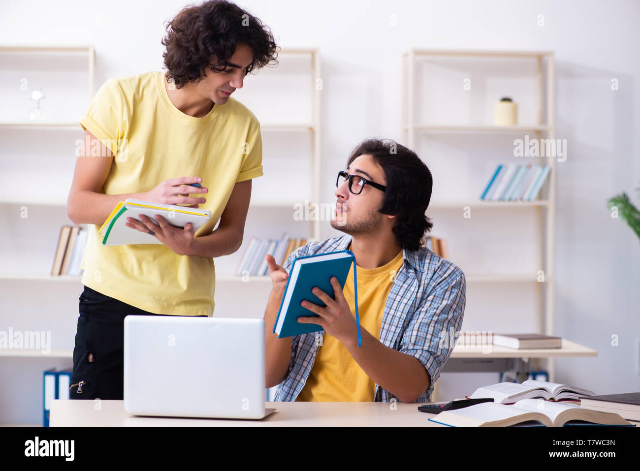 Two male students in the classroom Stock Photo - Alamy