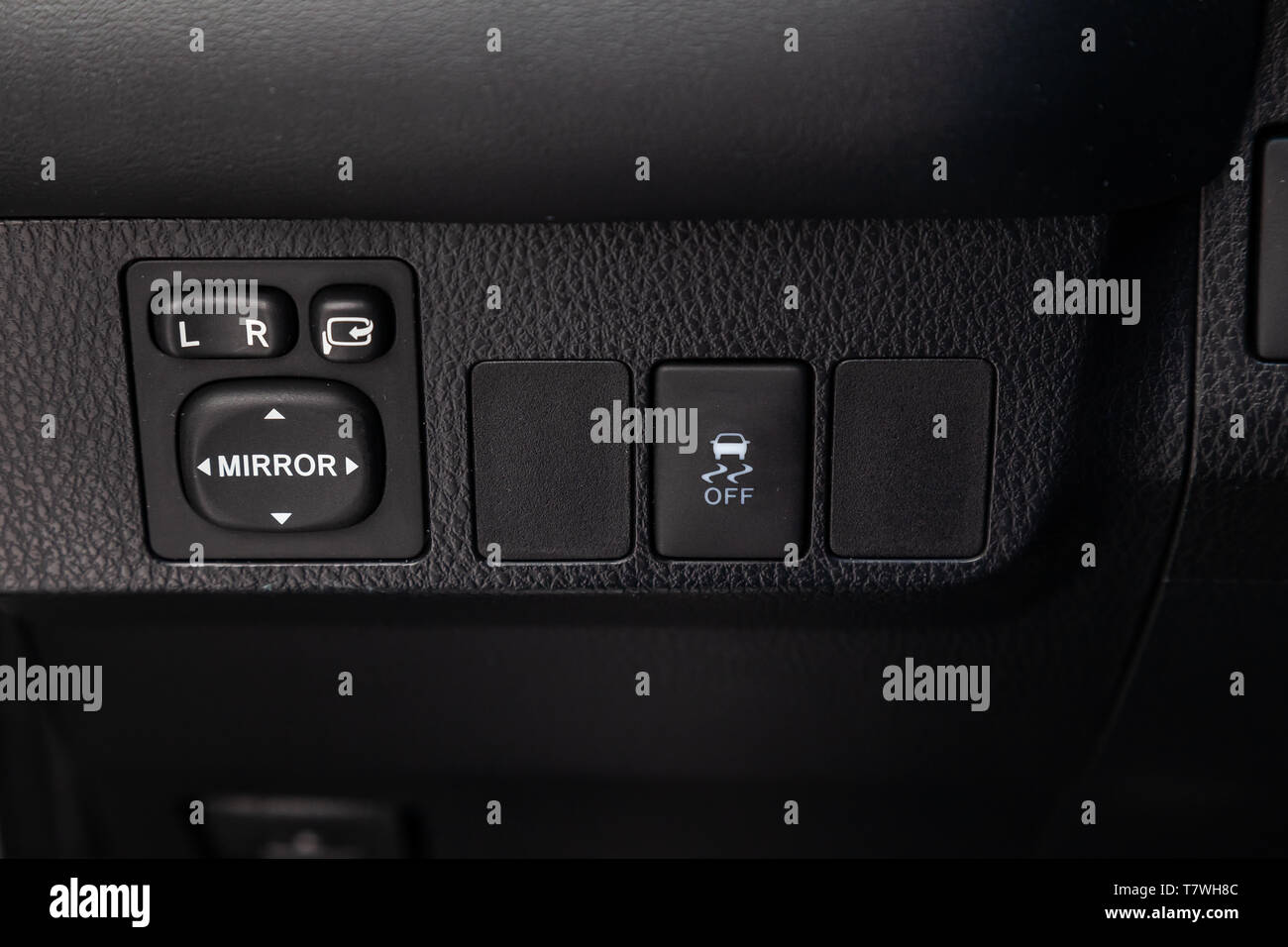 The buttons for controlling the mirrors electric drive on the center ...