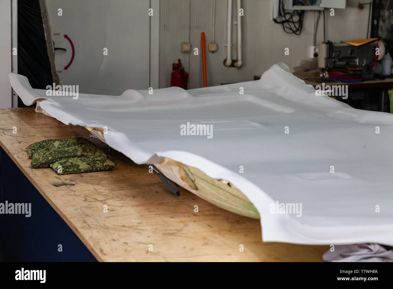 Gray ceiling lining removed from the car for tuning and bracing with ...