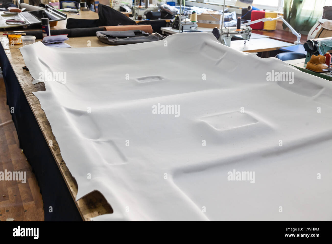 Gray ceiling lining removed from the car for tuning and bracing with ...