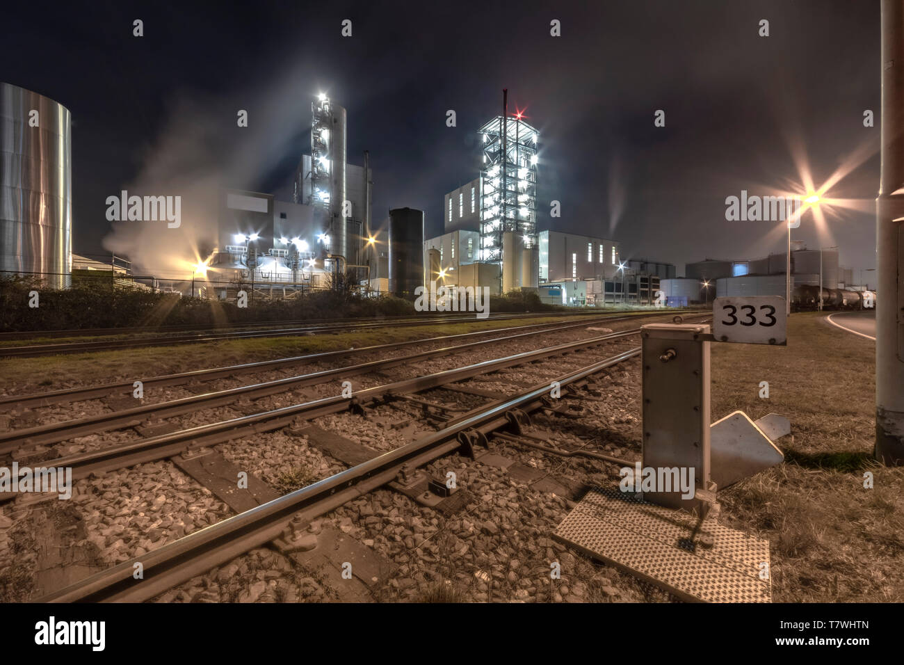 Night view of an industrial zone with the rail road checkpoint ...