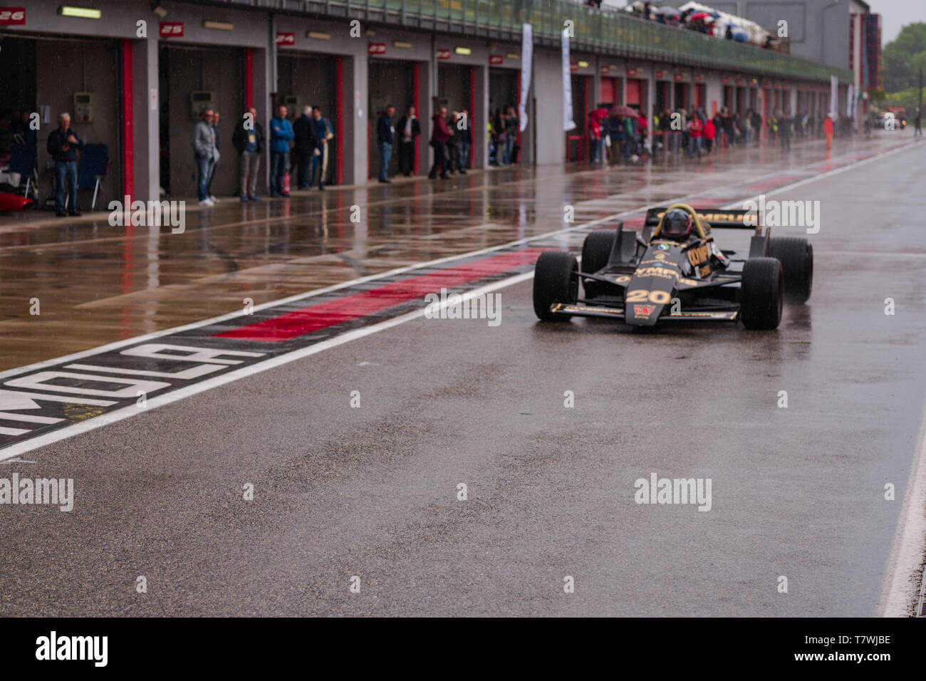 the famous Wolf Racing WR7 is leaving the pitlane for a wet track Stock ...