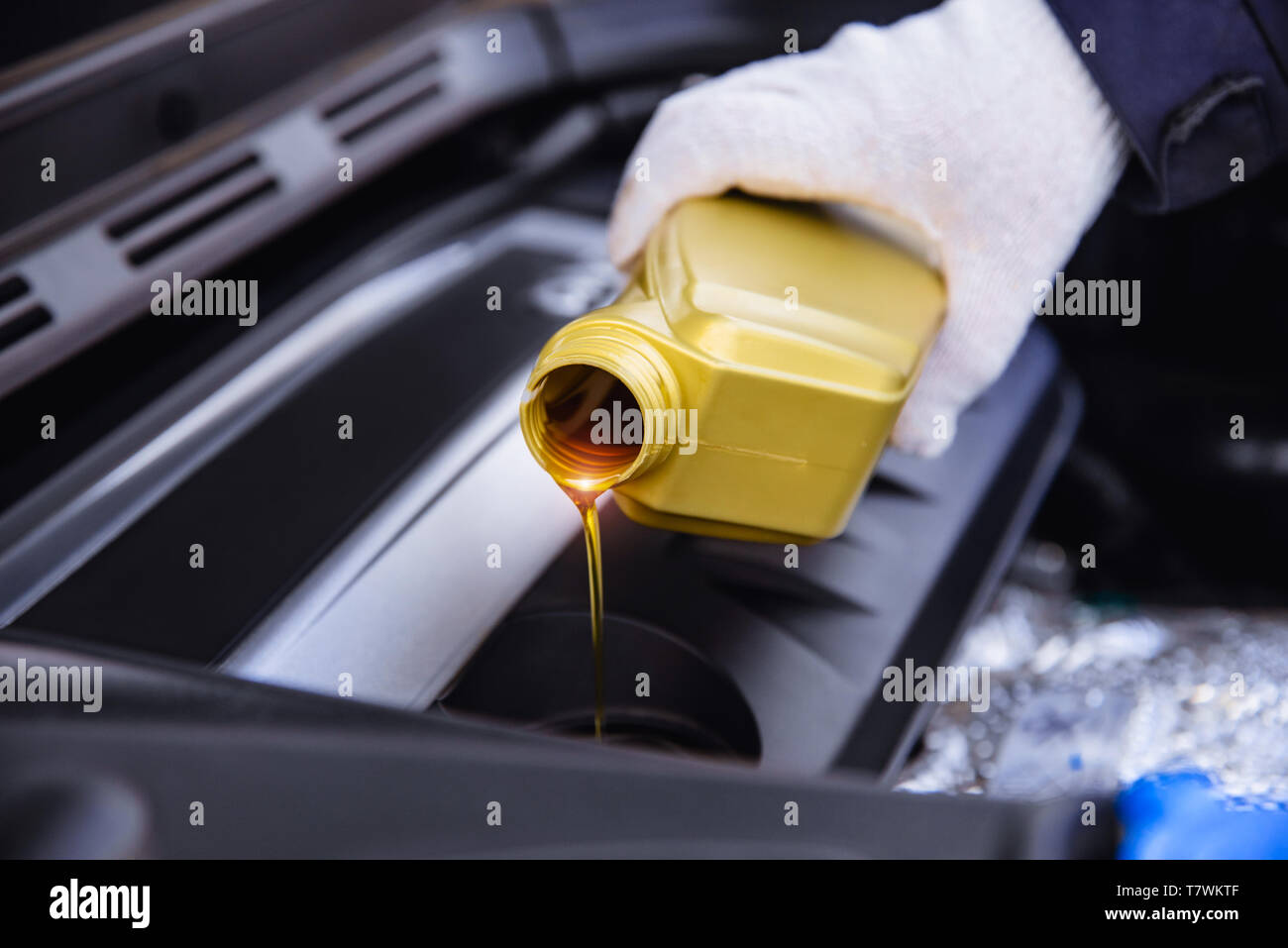 pouring engine oil into a car engine Stock Photo - Alamy pouring engine oil into a car engine Stock Photo - Alamy