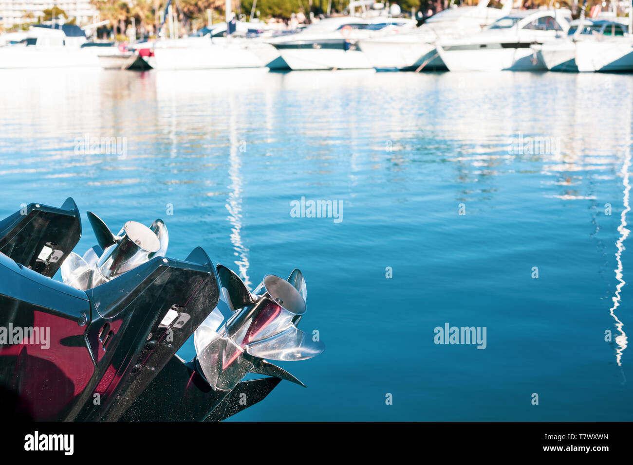 Two motor boat screws on sea water background. Horizontal day shot ...