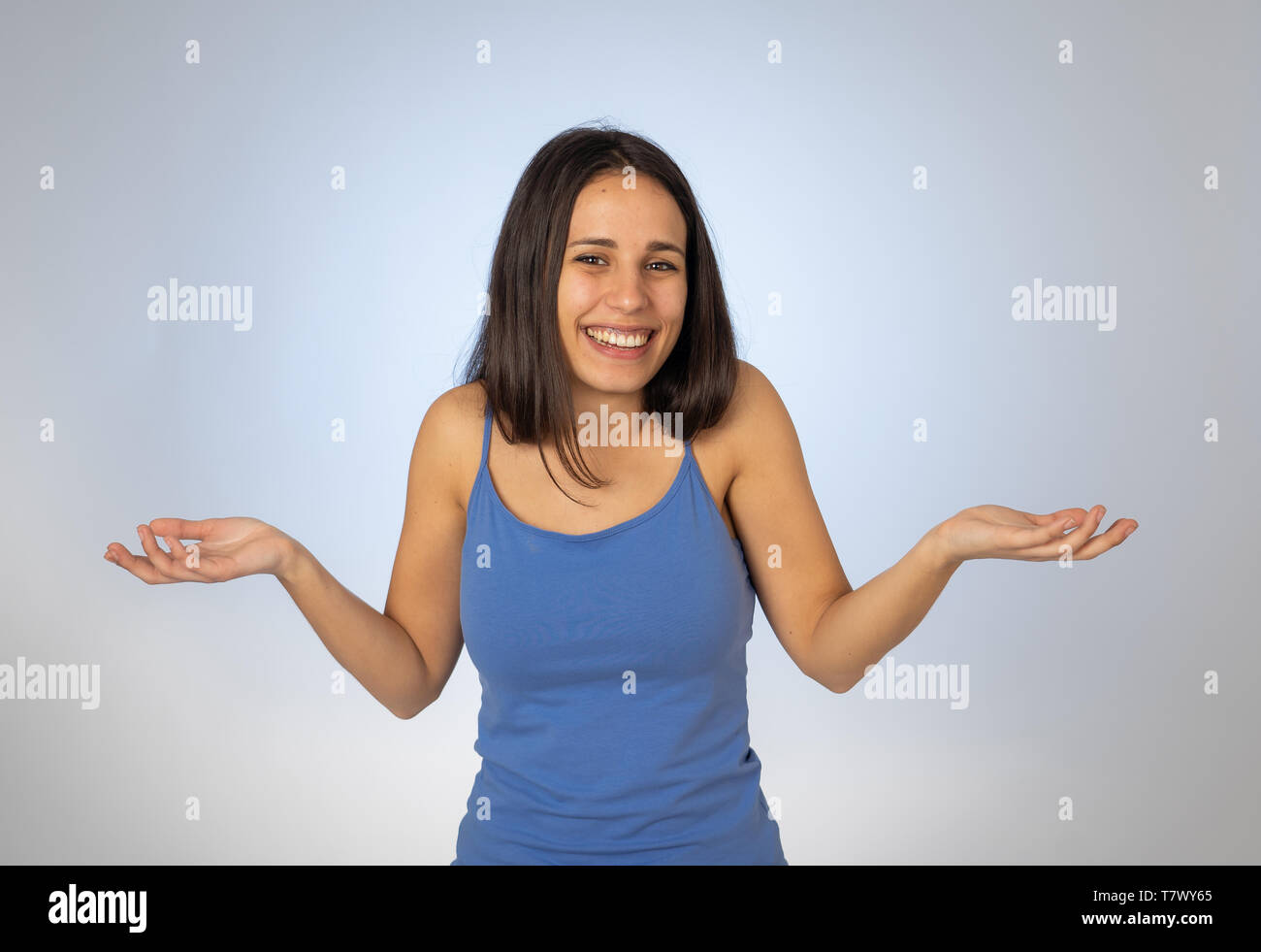Portrait of Attractive latin young woman making clueless gesture having ...