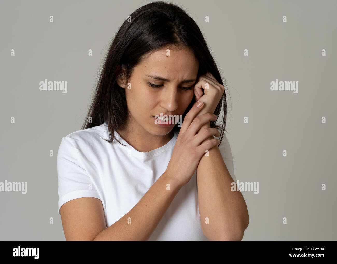 Portrait of a young sad woman, serious and concerned, looking worried ...