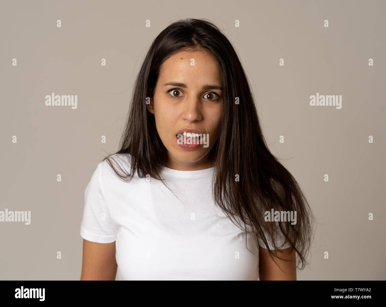 Portrait of beautiful shocked woman hearing good news or having great ...