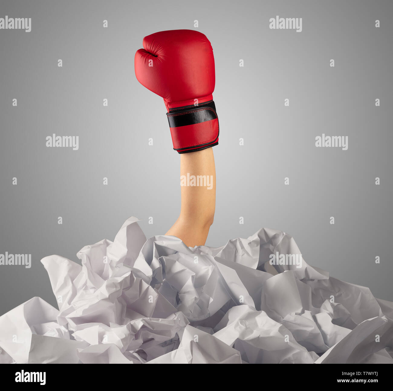 Hand breaking out from pile of paper Stock Photo - Alamy