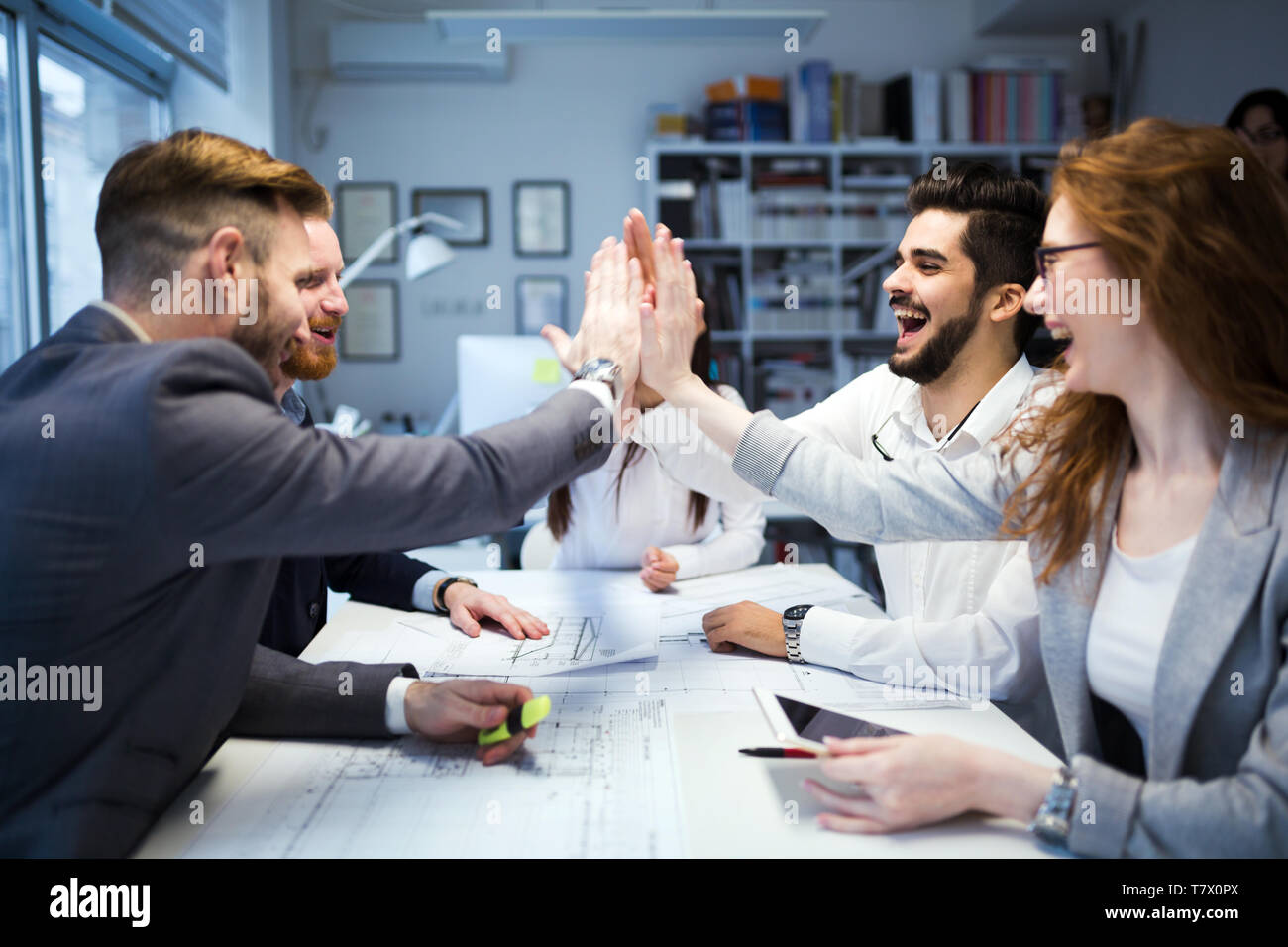 Business people working together on project and brainstorming in office ...