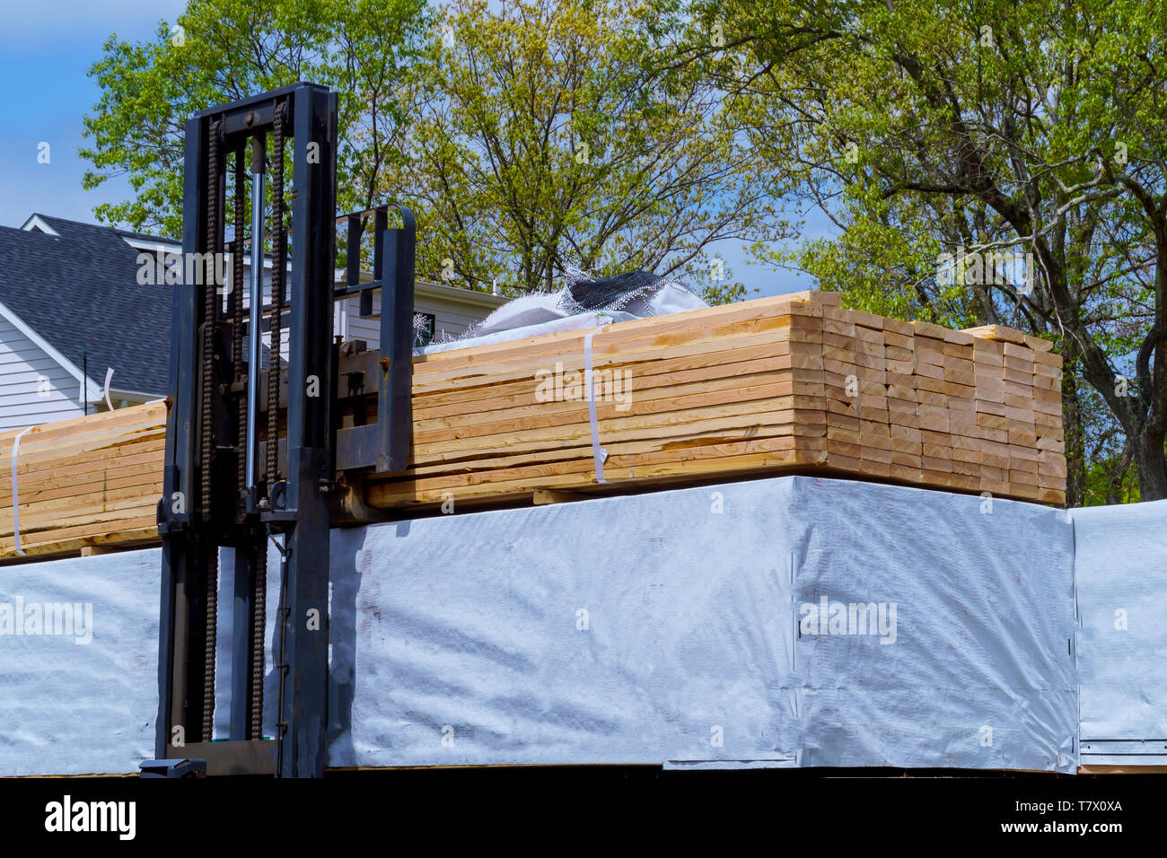 Forklift truck driver in an industrial area built home under ...