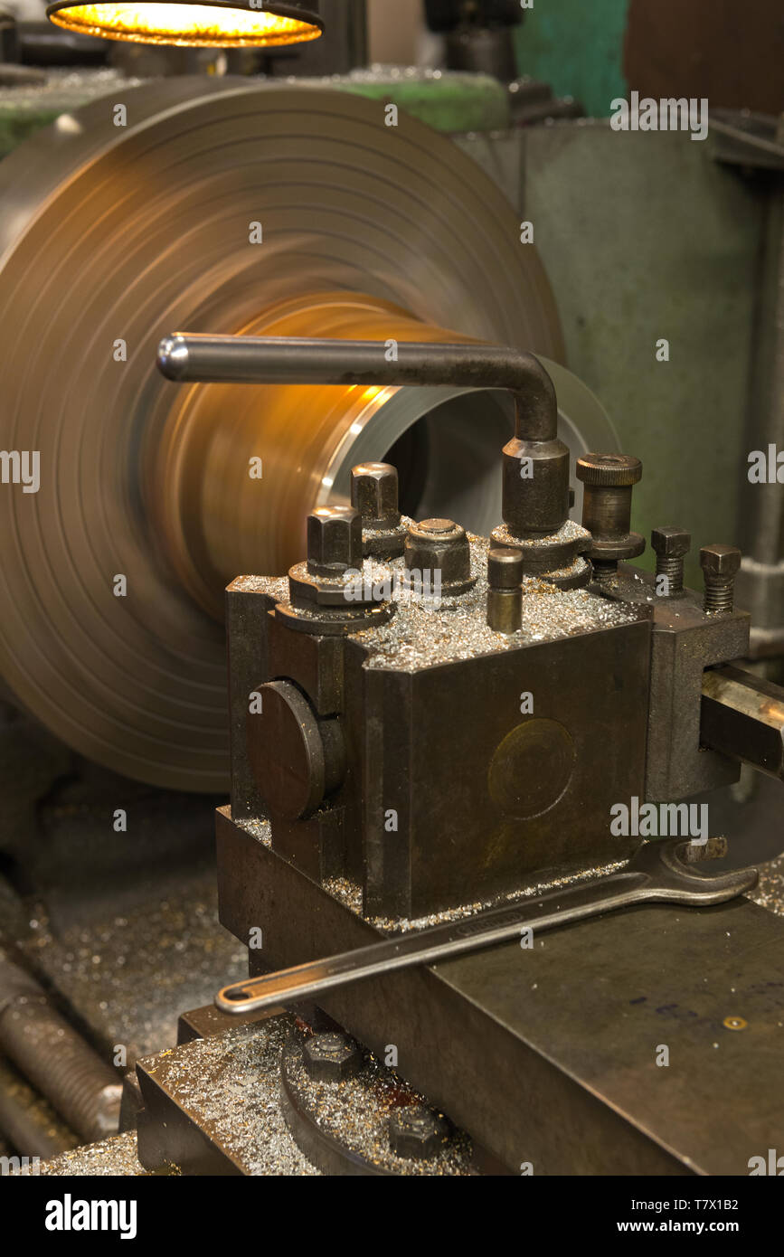 A white metal and brass bearing being turned on a lathe in the engine ...