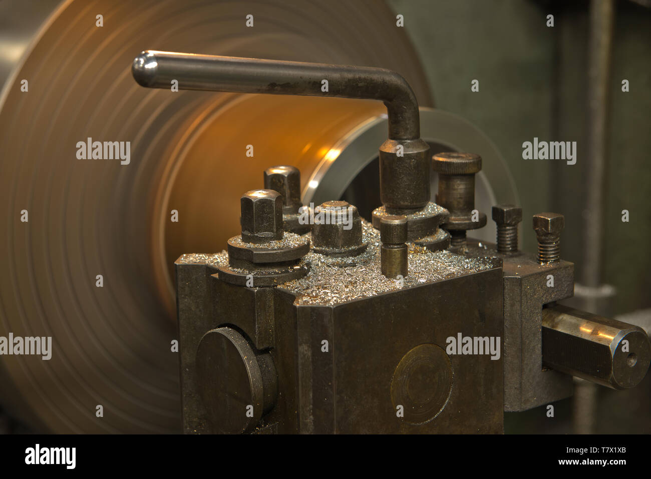 A white metal and brass bearing being turned on a lathe in the engine ...