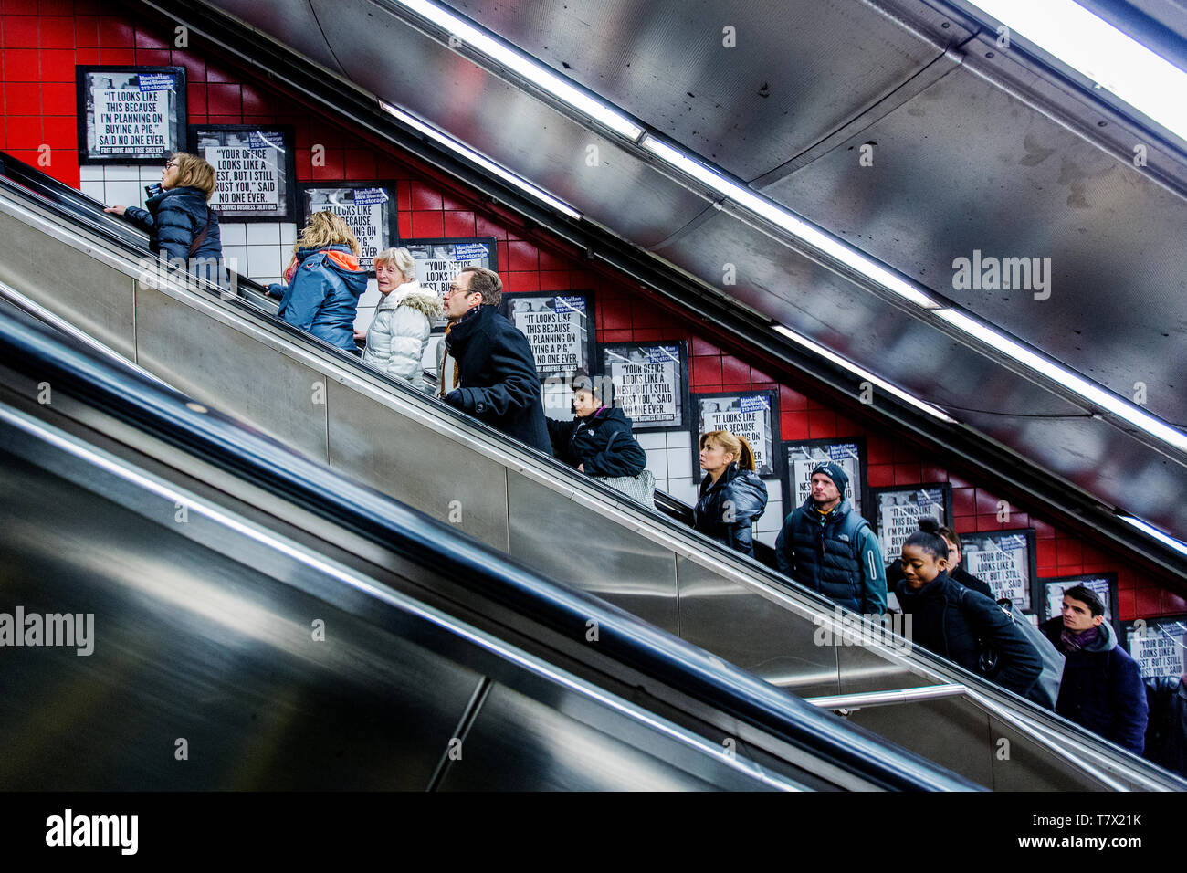 Daily commuters on their way up a New York subway escalator Stock Photo ...