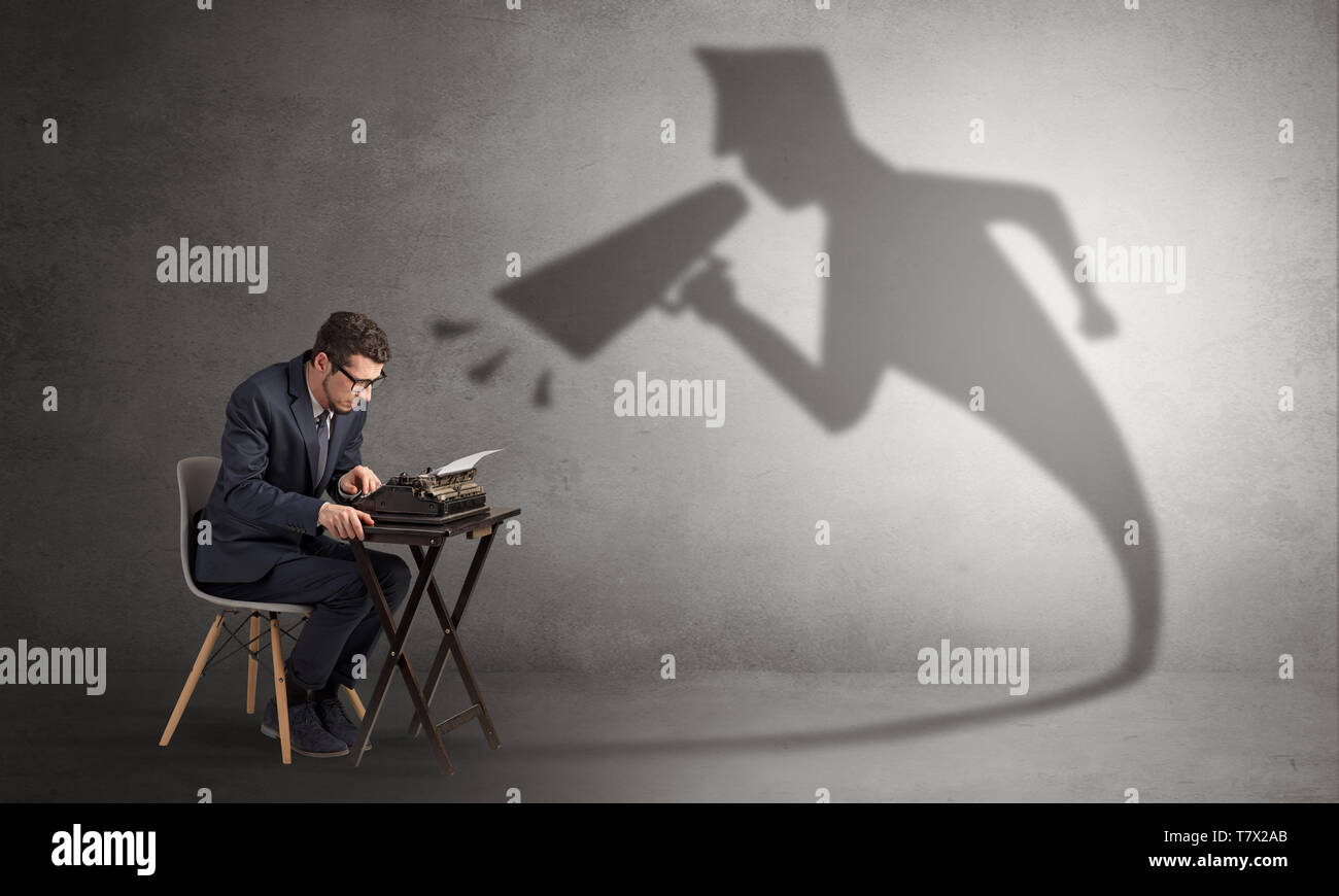 Hard working businessman shadow yelling to himself concept Stock Photo ...