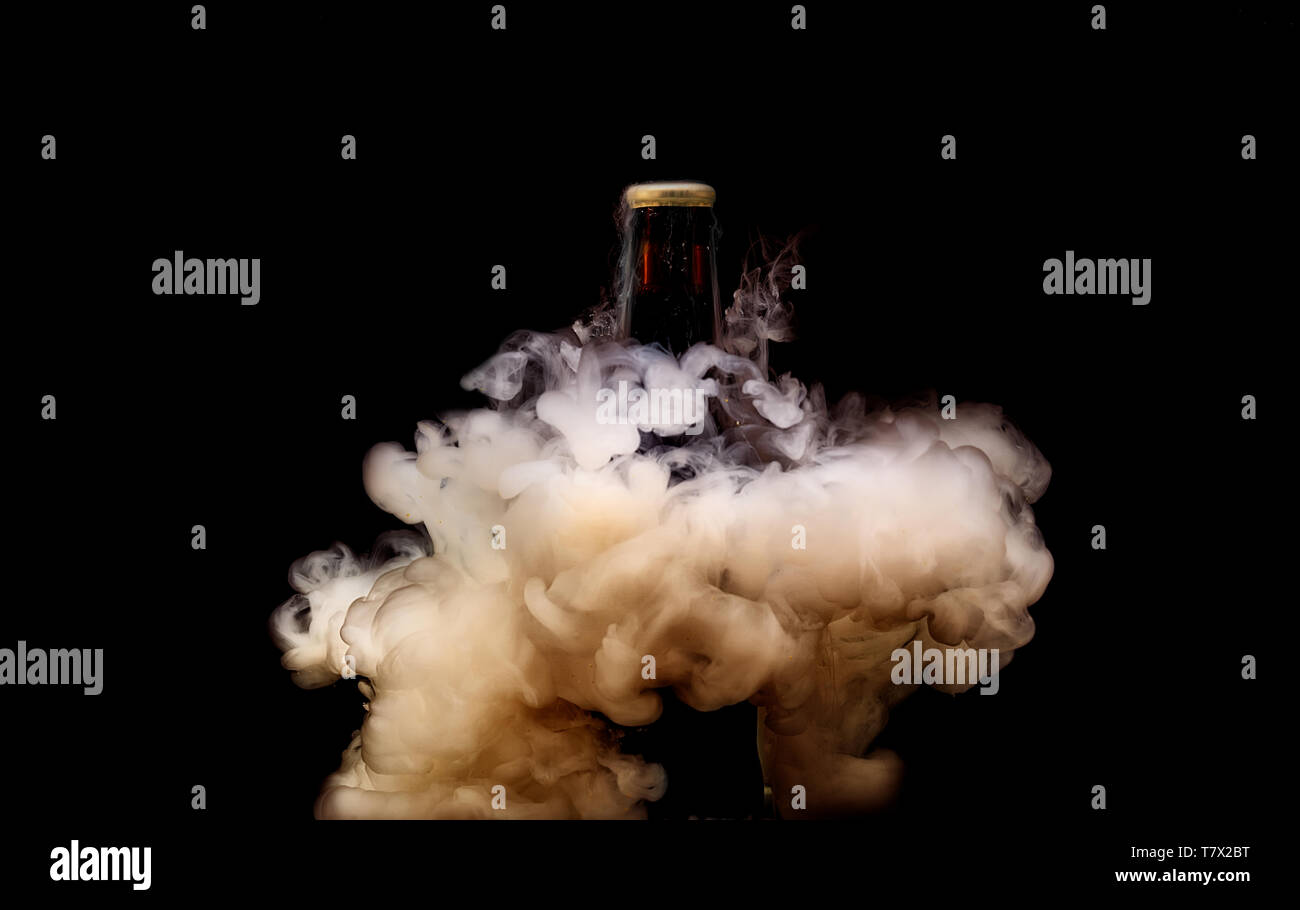 Liquid water explosions surrounding beer bottle. Underwater liquid ...