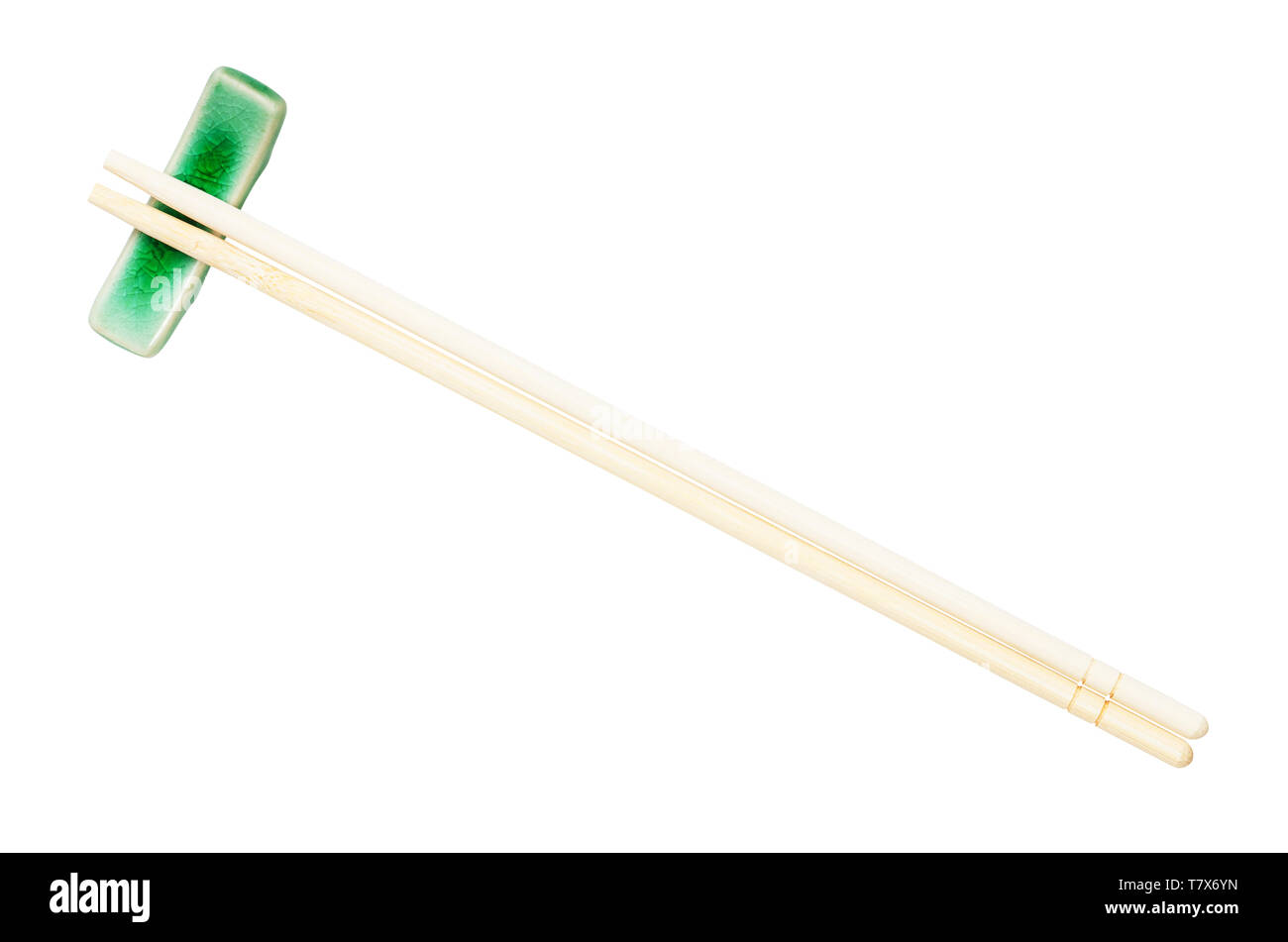 top view of carved disposable wooden chopsticks served on chopstick ...