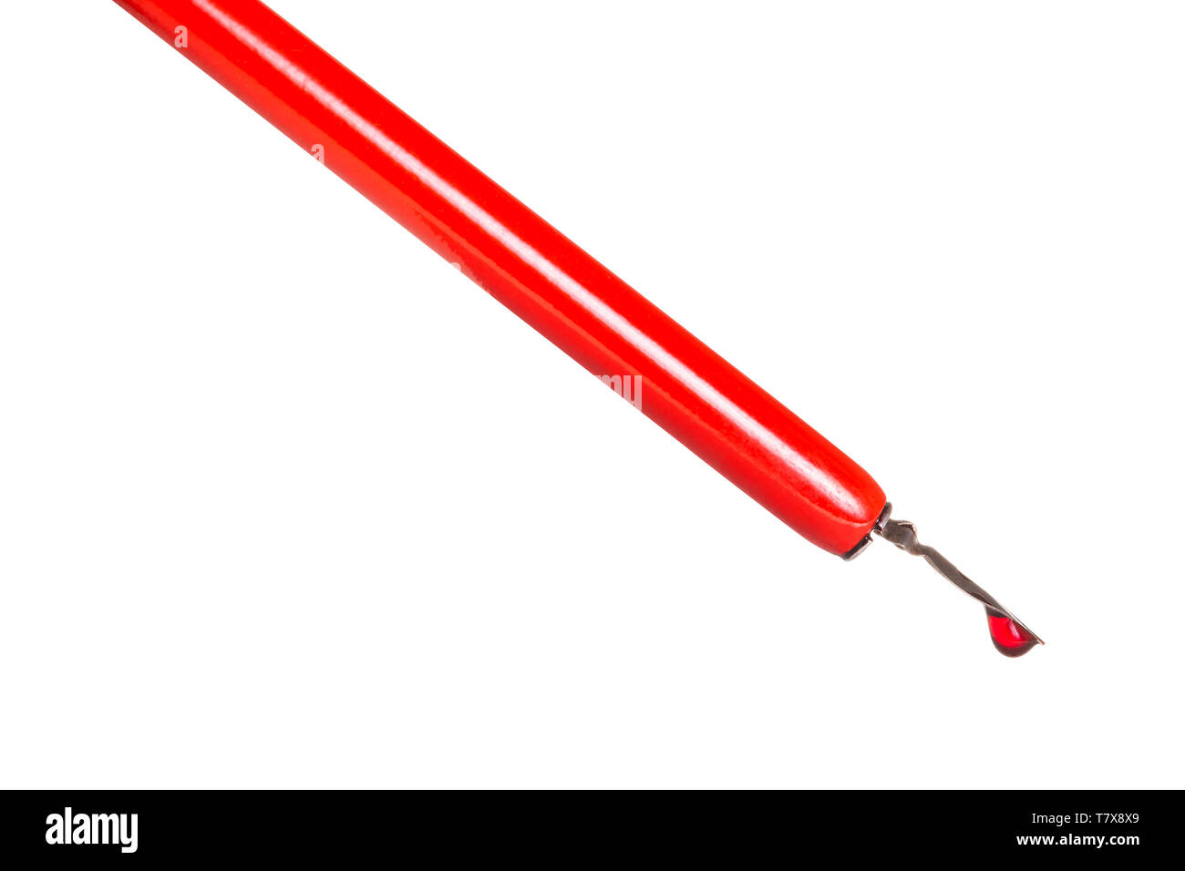 side view of ink drop in red dip pen close up isolated on white ...
