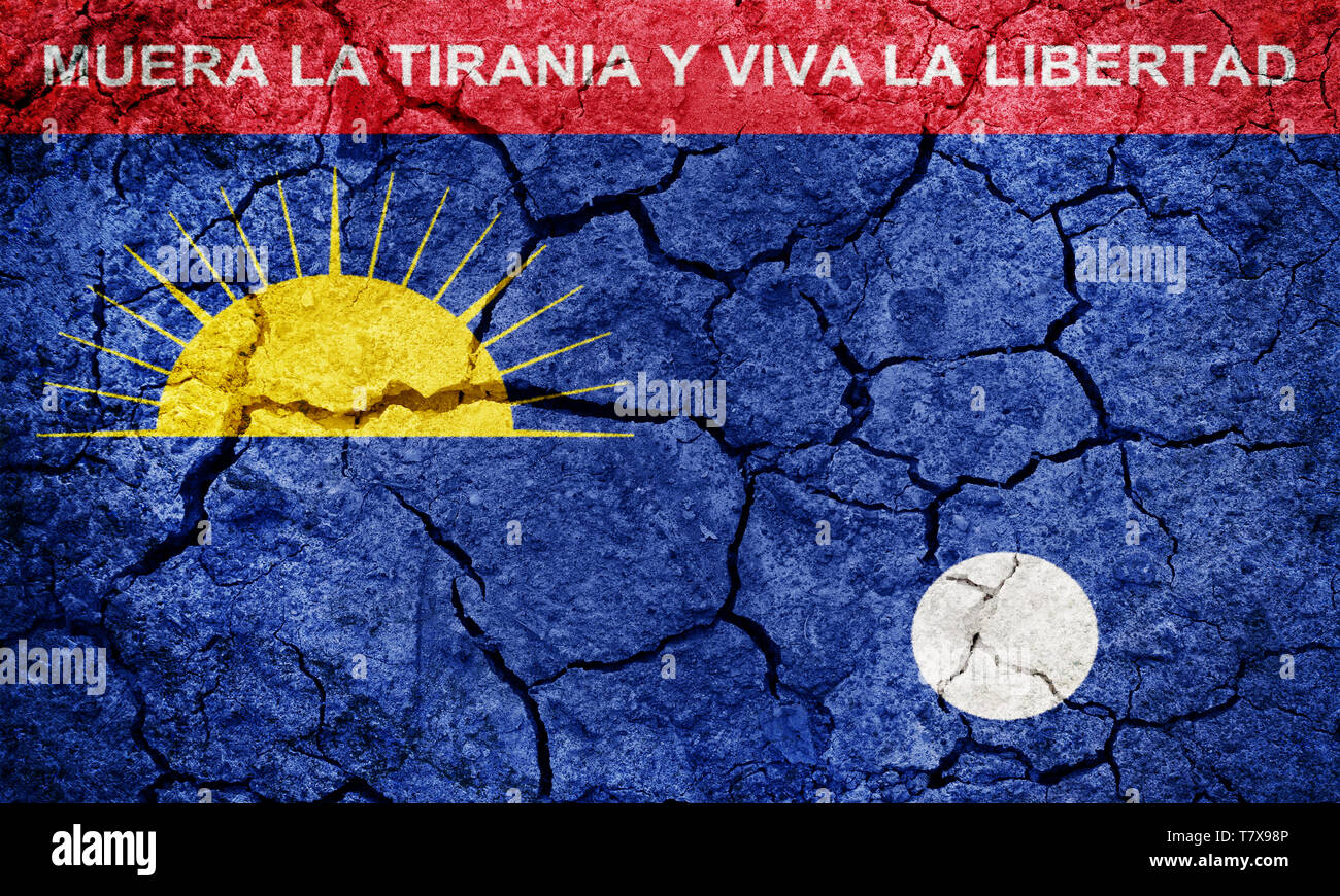 Falcon State flag, state of Venezuela, on dry earth ground texture ...