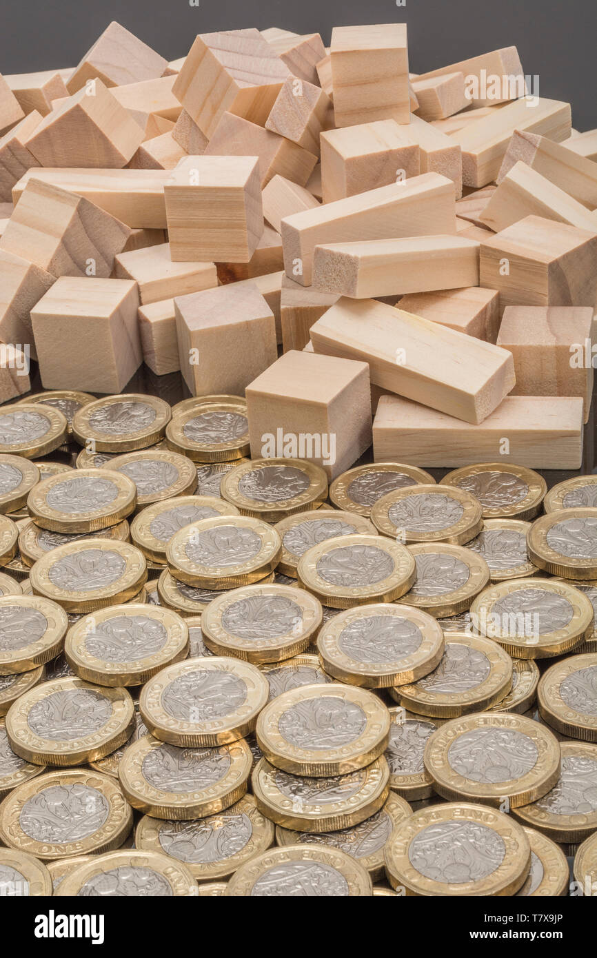 New pound coins + jumbled / tumbled wooden bricks & blocks. Sterling ...