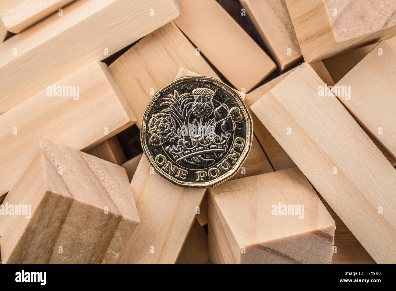New pound coins + jumbled / tumbled wooden bricks & blocks. Sterling ...