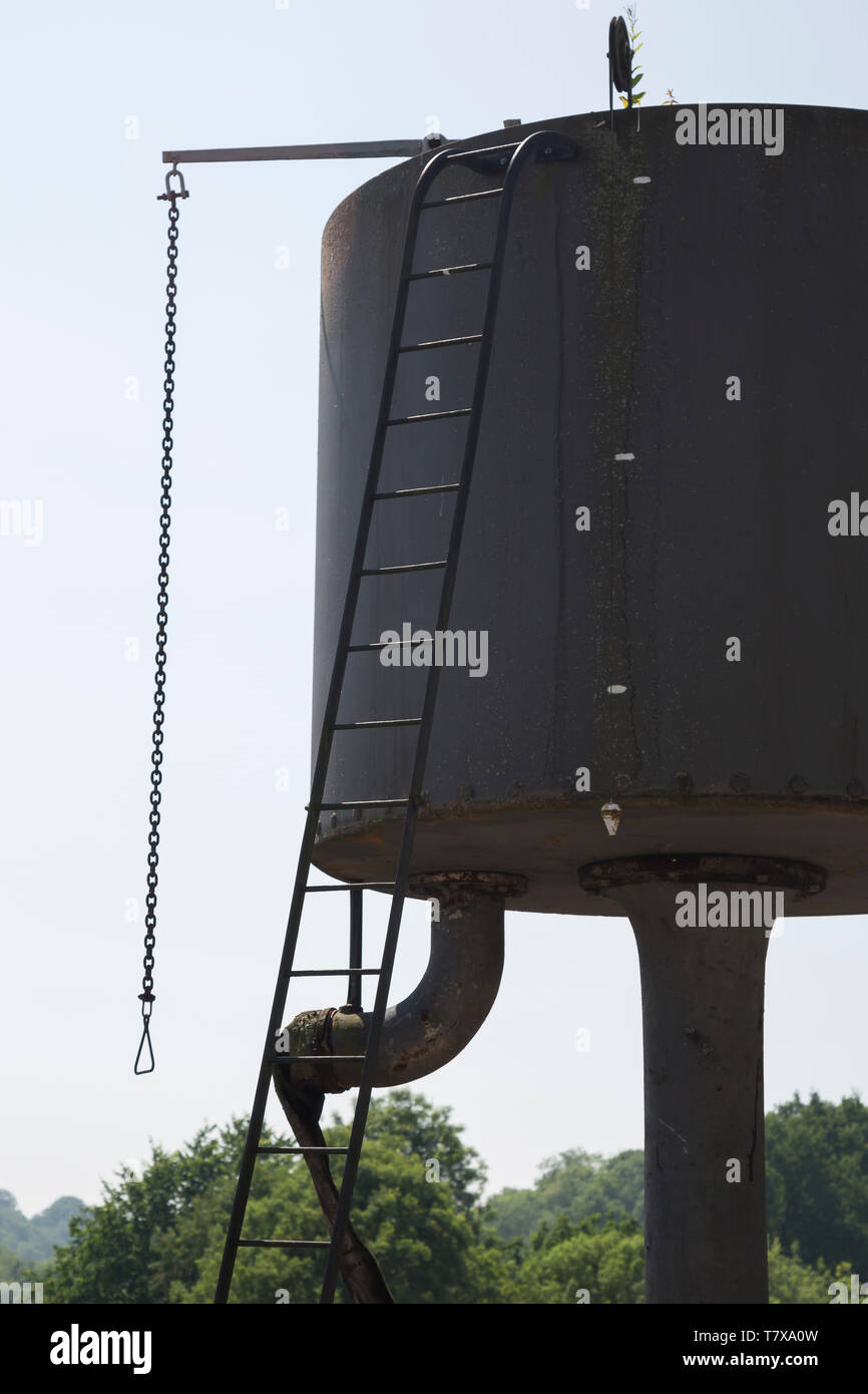 Close up of operating water tower used for filling tanks of vintage ...