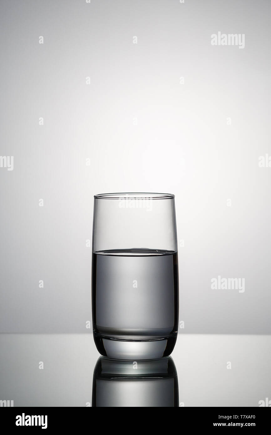 Glass of clean water on the glass with reflection Stock Photo - Alamy
