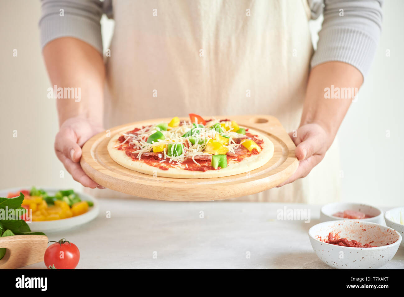Step-by-step boss makes a pizza margarita. Dough and pizza ingredients ...