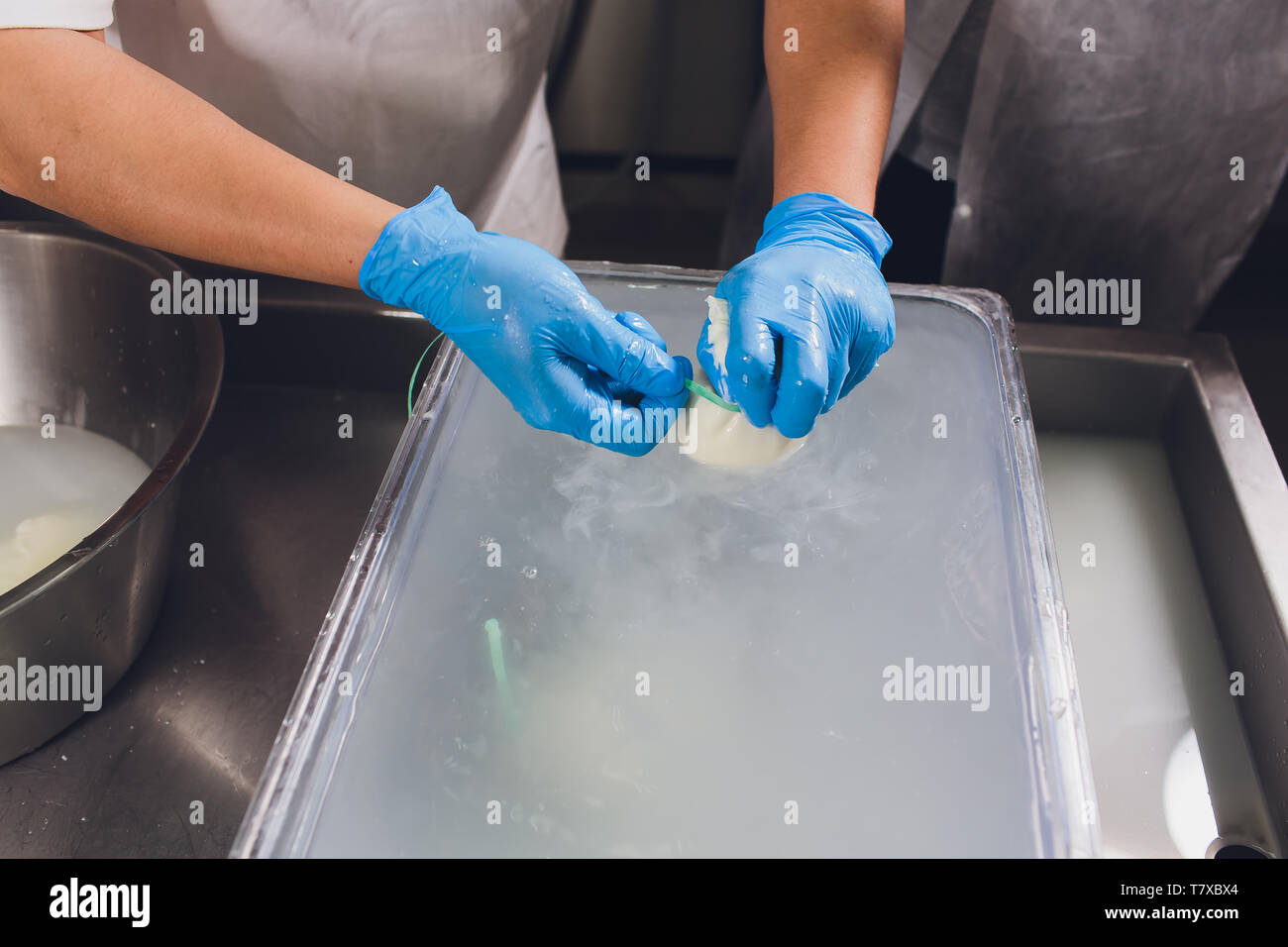 Production process of mozzarella cheese, cheese making process Stock ...