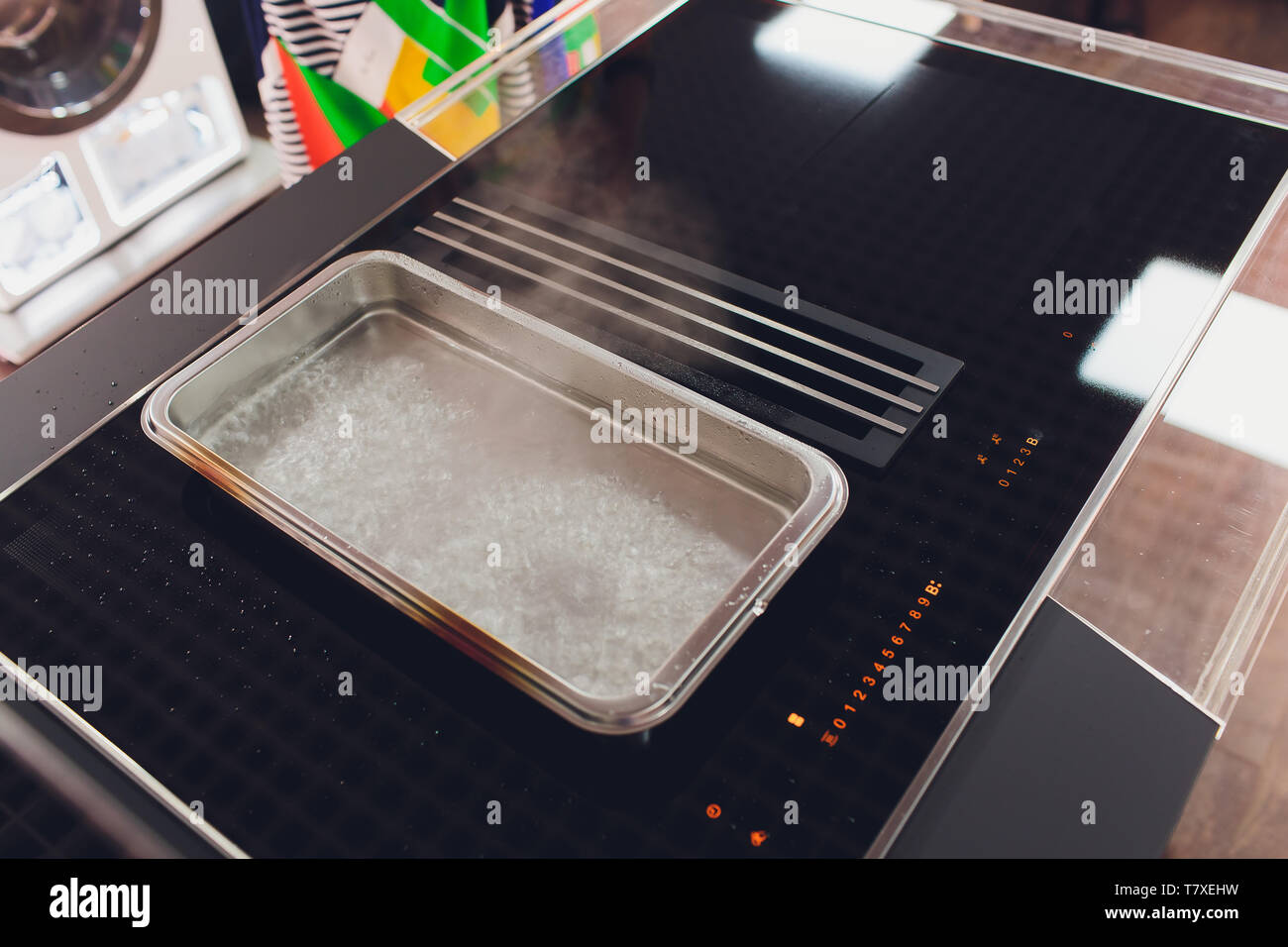 Closeup of exhaust hood and ceramic cooking plate in the new modern ...