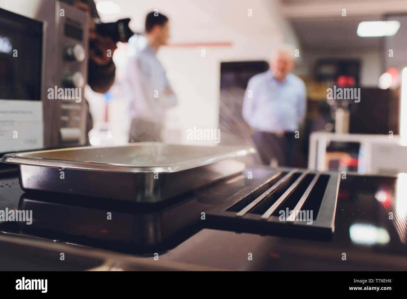 Closeup of exhaust hood and ceramic cooking plate in the new modern ...