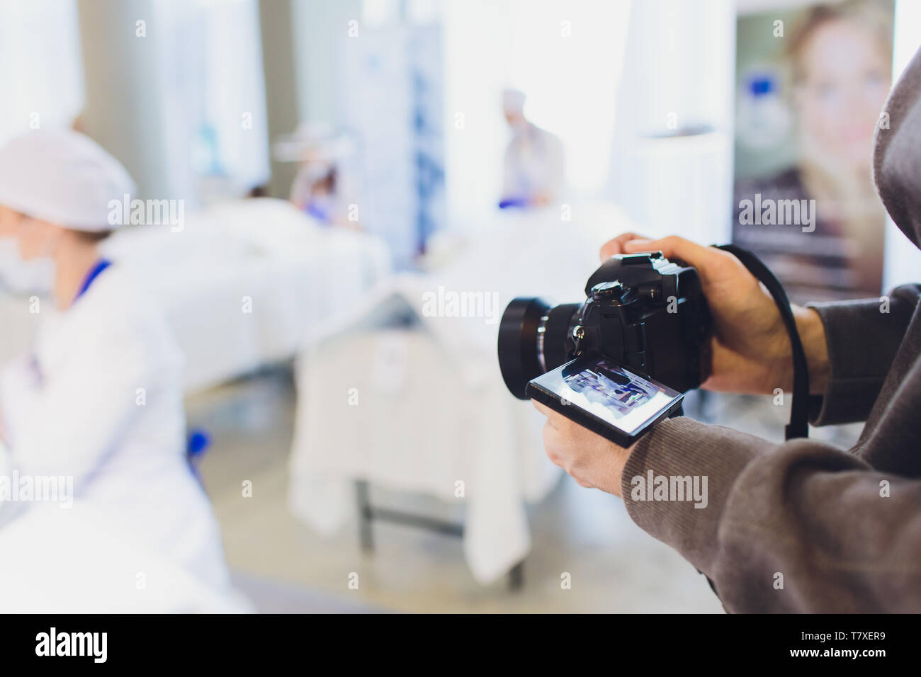 Man holding photo camera in hand outdoor, photographer concept ...