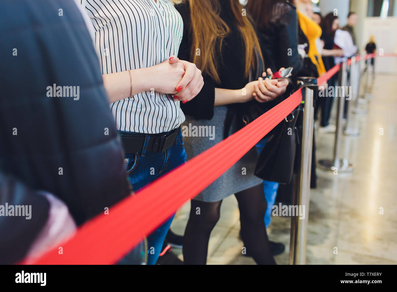 Blurred picture of Long Passenger Queue Waiting for Check-in at Airport ...