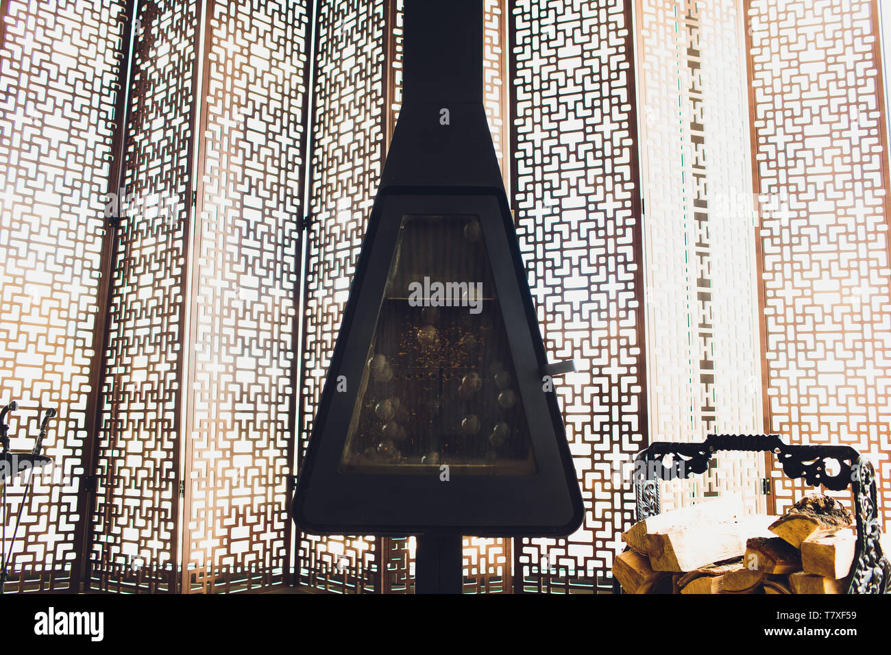 Stylish modern room with a burning fireplace, modern hinged fireplace ...