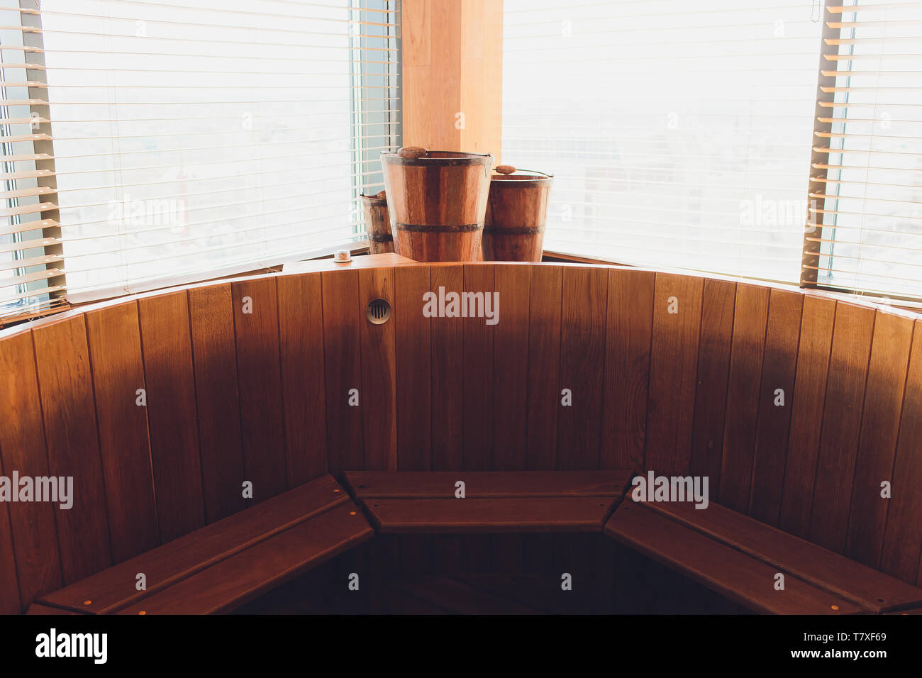 Hot tub taking a relax bath in the in the sauna next to the window ...