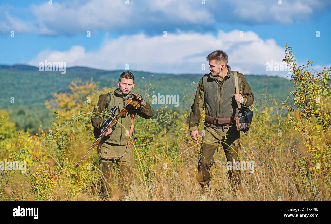 Military uniform fashion. Friendship of men hunters. Hunting skills and ...